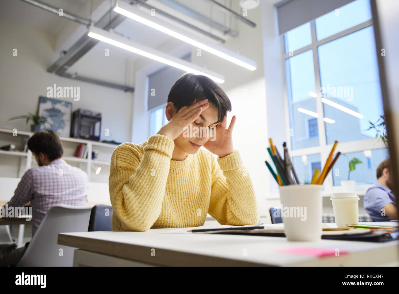 Exhausted young woman office desk hi-res stock photography and images ...