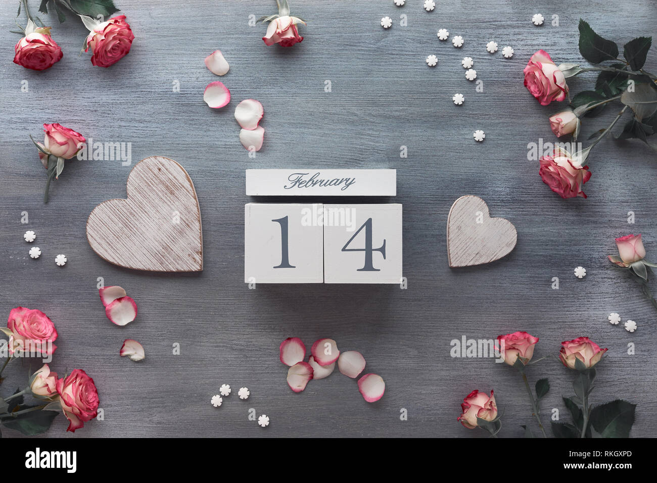 Valentine's day celebration, flat lay with wooden calendar, pink roses ...