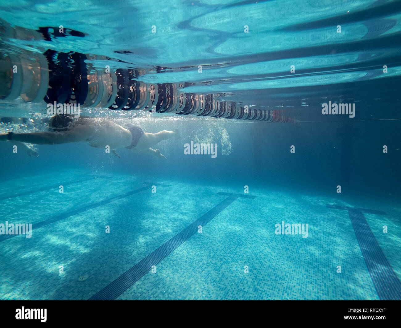 people swimming in pool view from the underwater Stock Photo - Alamy