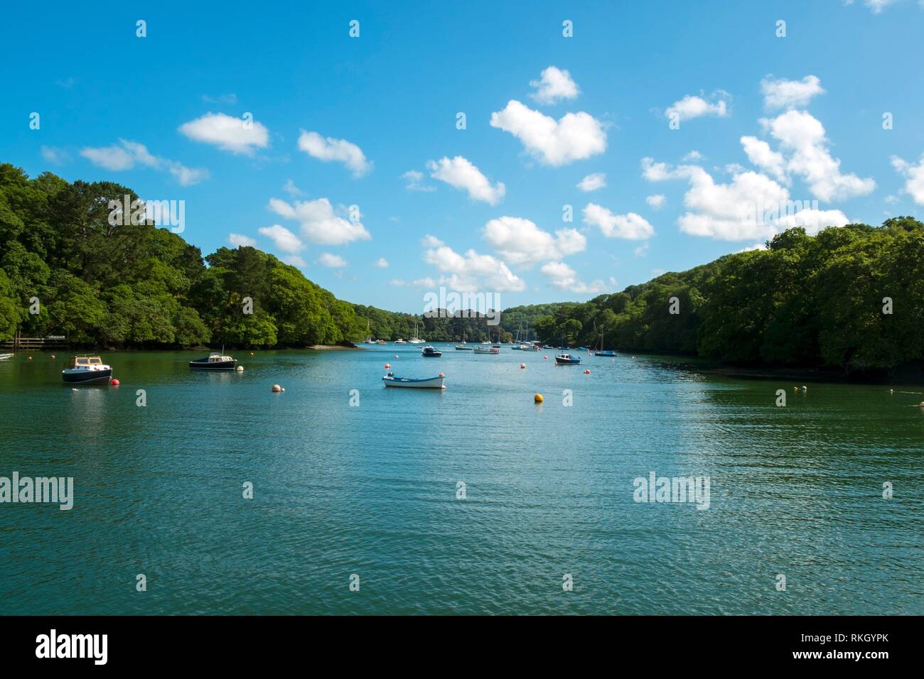 Early summer afternoon sunshine on idyllic small boat moorings in the ...
