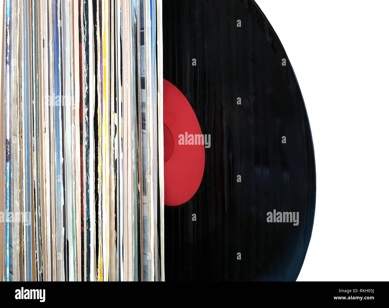 Vinyl record inserted to vertical paper covers pile isolated on white ...