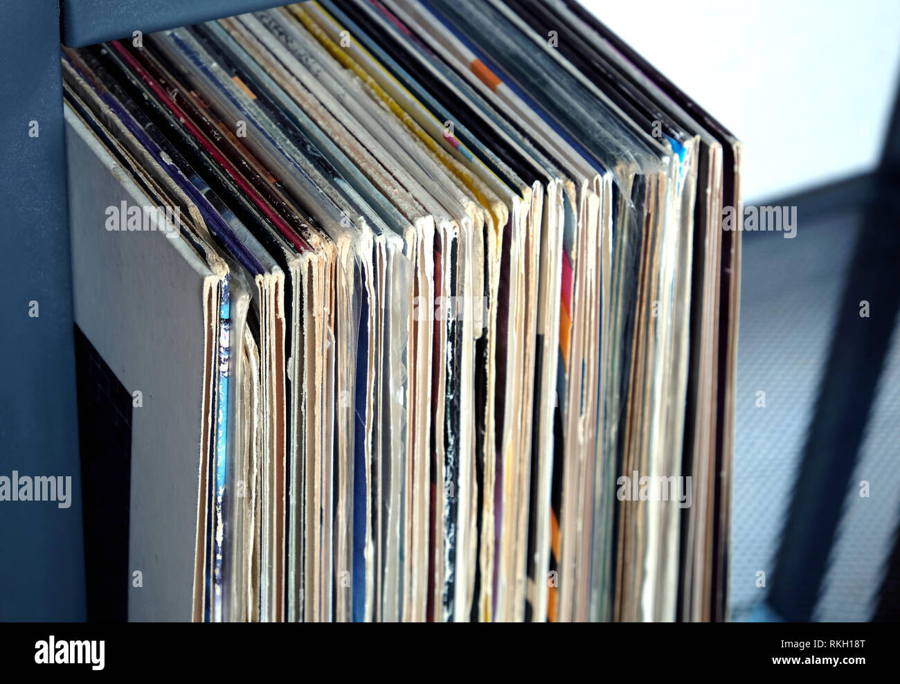 Pile of many close standing vinyl records in old color covers on a ...