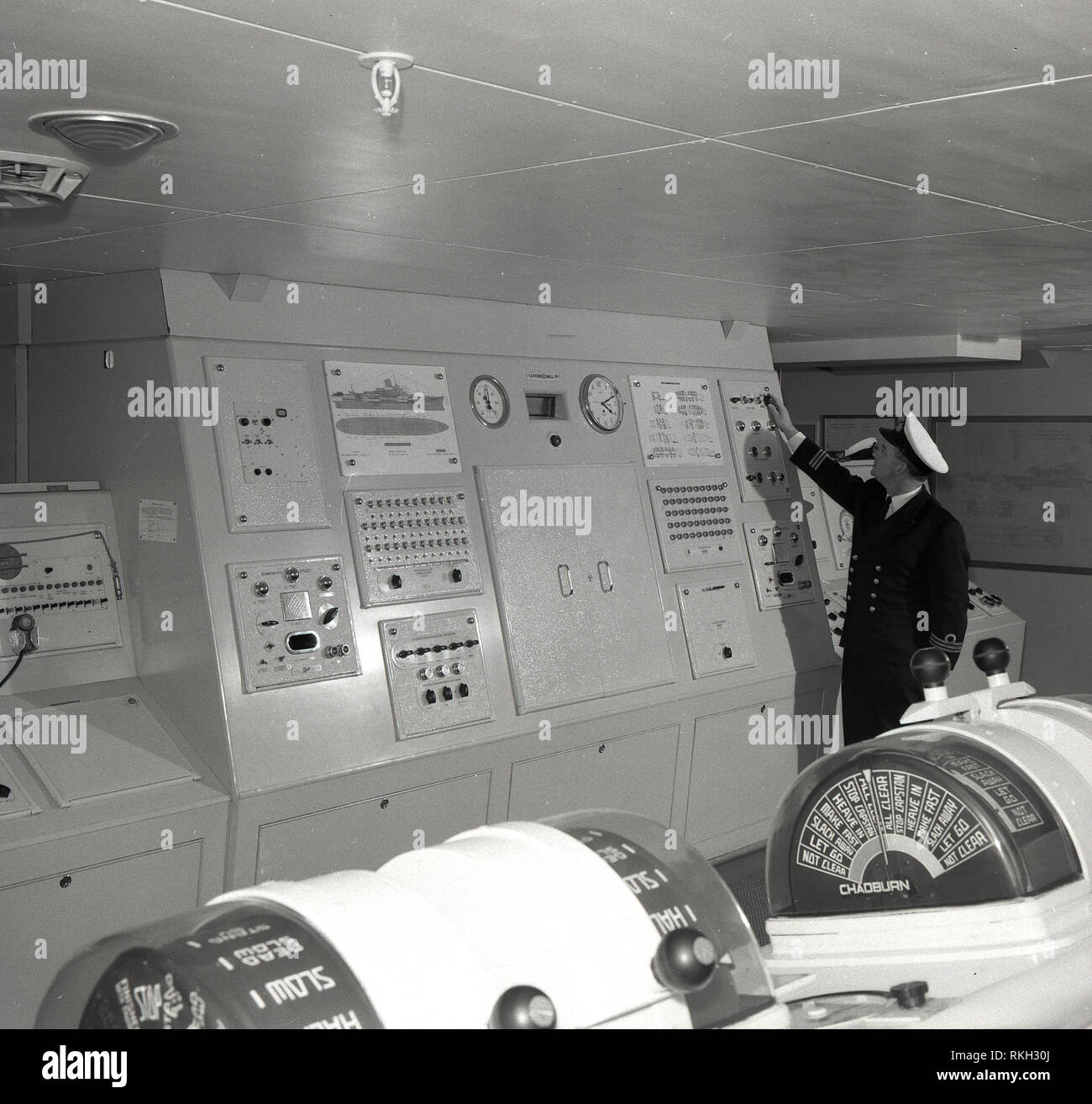 1960s, Union-Castle cruise ship, a uniformed officer on the bridge of ...