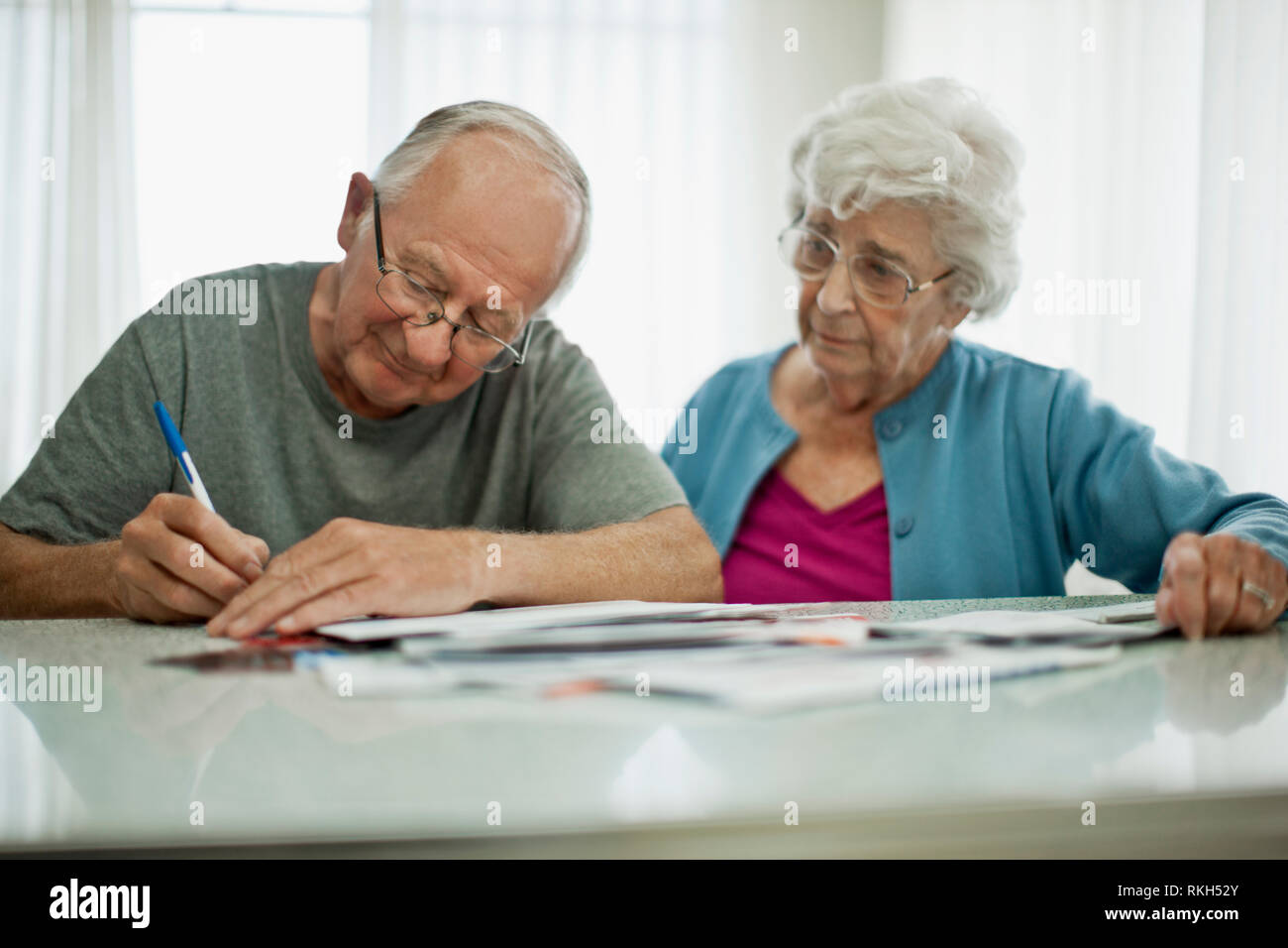 Senior woman pile work hi-res stock photography and images - Alamy
