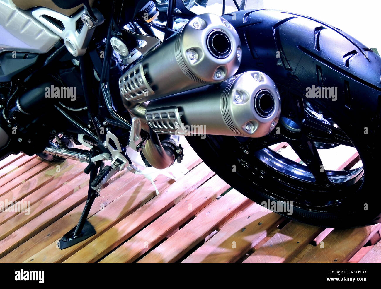Sport motorcycle double exhaust round pipes Stock Photo - Alamy