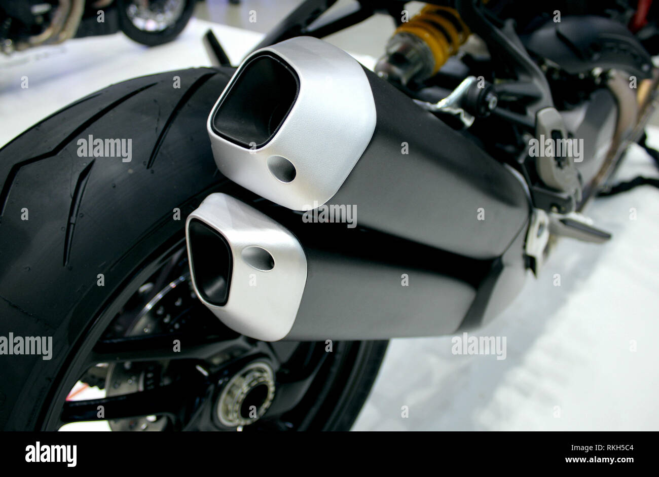 Motorcycle exhaust system with plastic overlay Stock Photo - Alamy