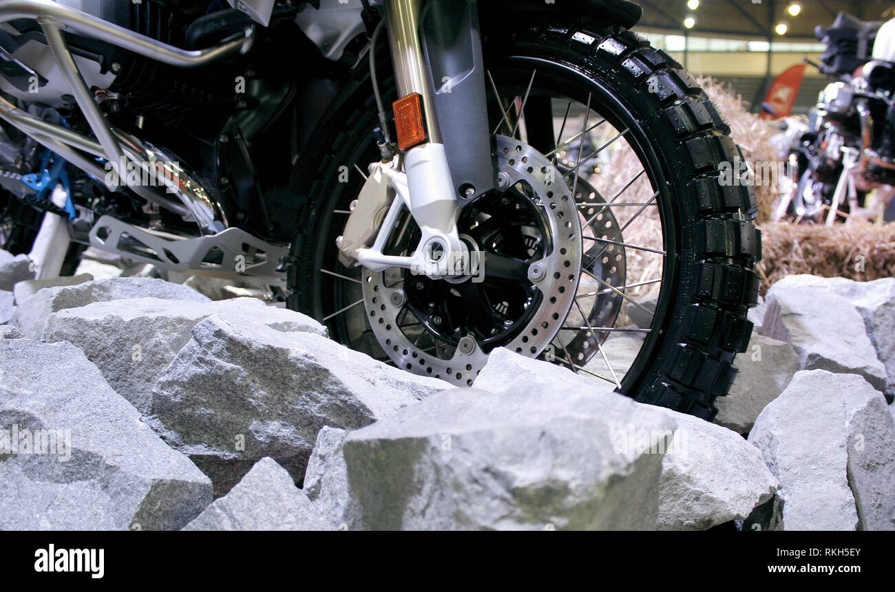 Brake disc and offroad tire on the front wheel of enduro motorcycle ...