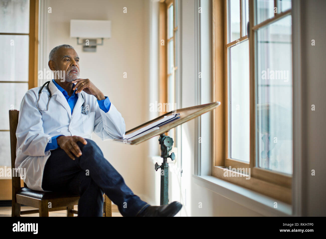 African senior man doctor stethoscope hi-res stock photography and ...