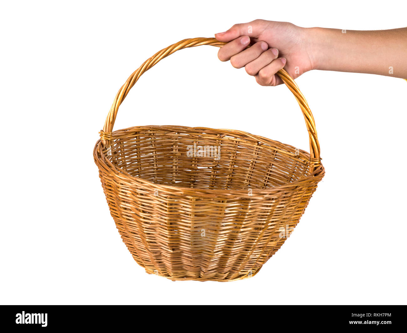 Empty wicker basket for fruits and vegetables in hand isolated on white ...