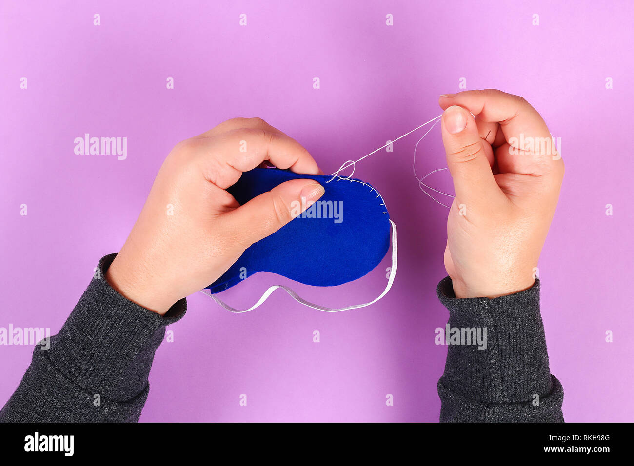 Diy blue felt sleep mask with white thread embroidered with closed eyes ...