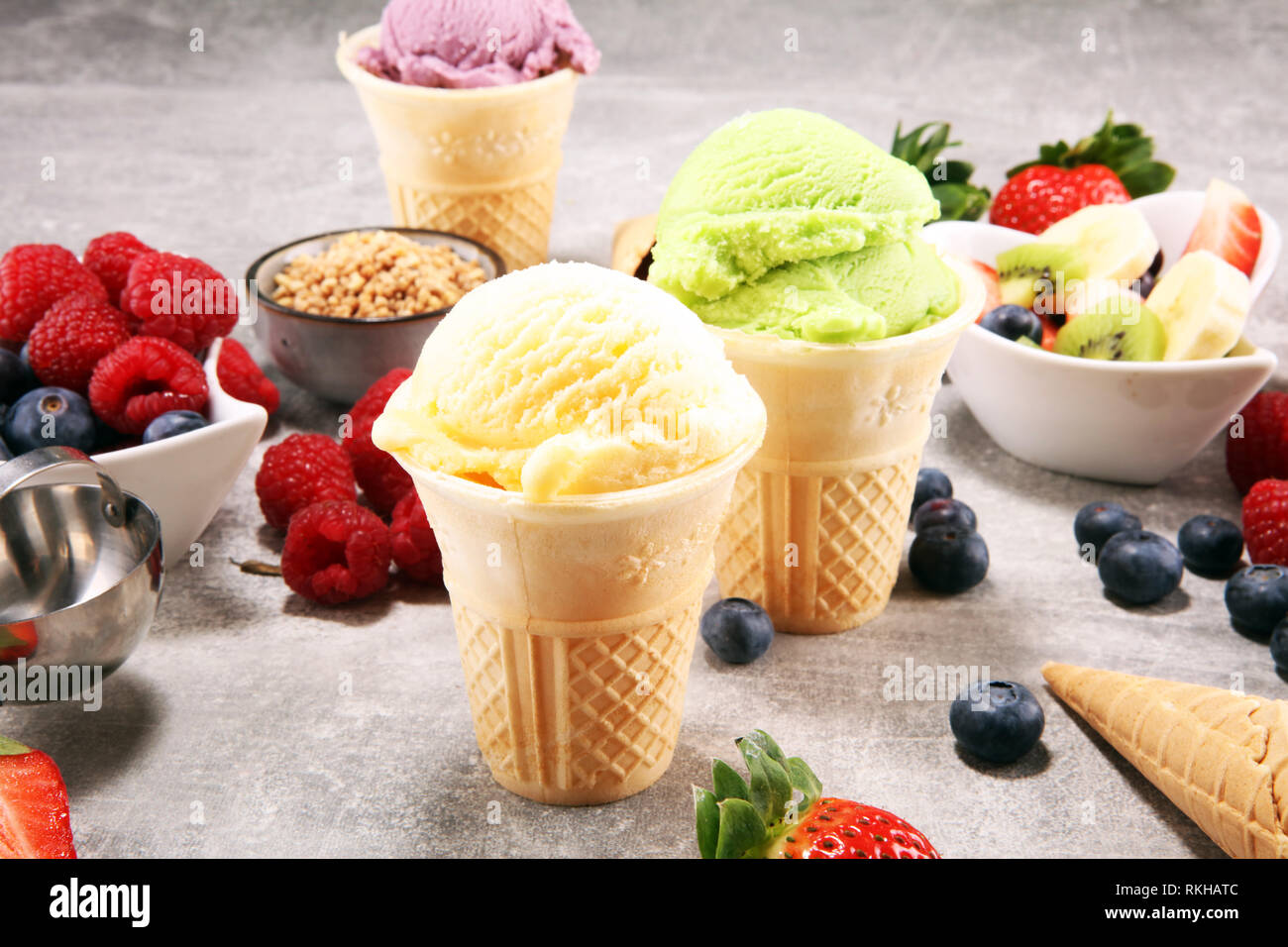 Set of ice cream scoops of different colors and flavours with berries ...