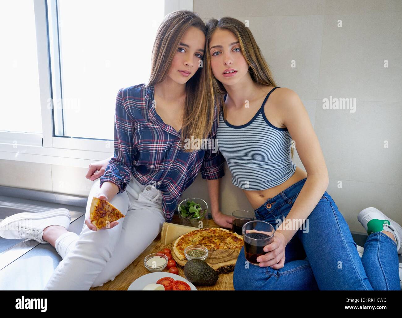 Woman kitchen eating jeans hi-res stock photography and images - Alamy