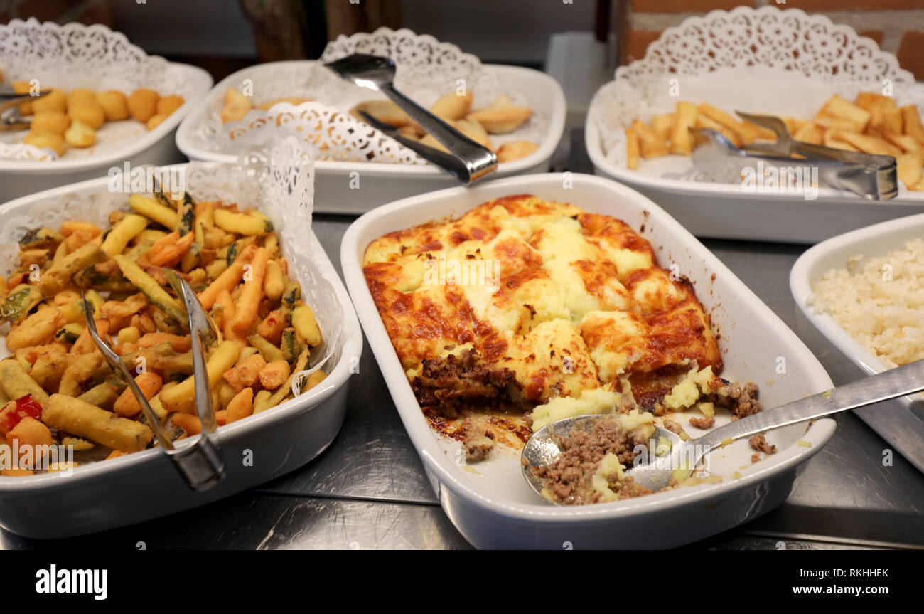 Inside a self service restaurant with many raw and cooked foods Stock ...