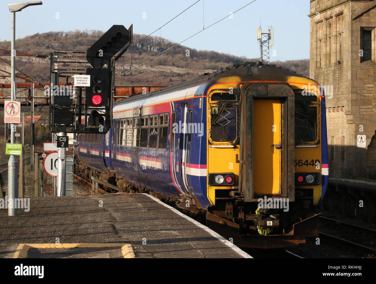 Class 156 diesel multiple unit train leaving Carnforth railway station ...