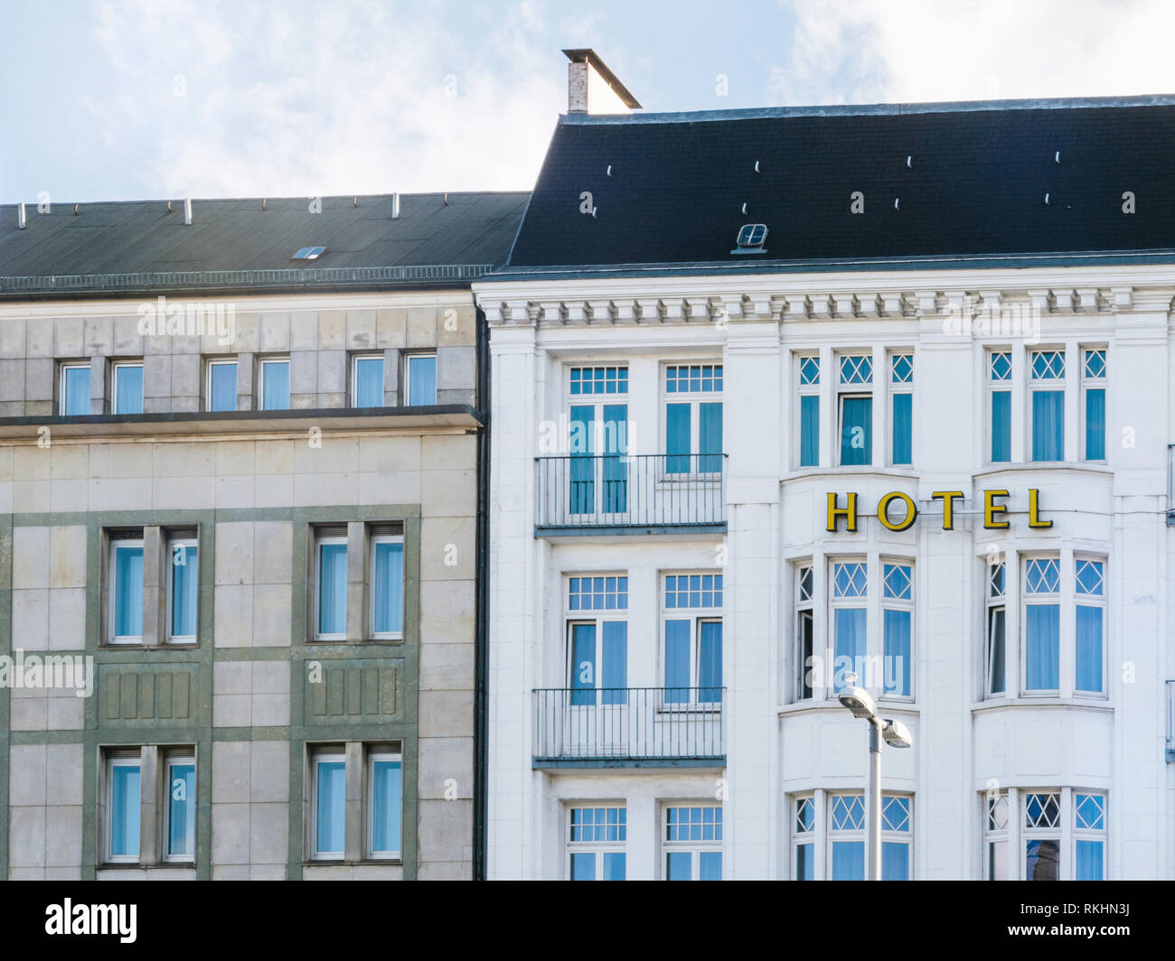 Hotel signage on the facade of a white building in German city of ...