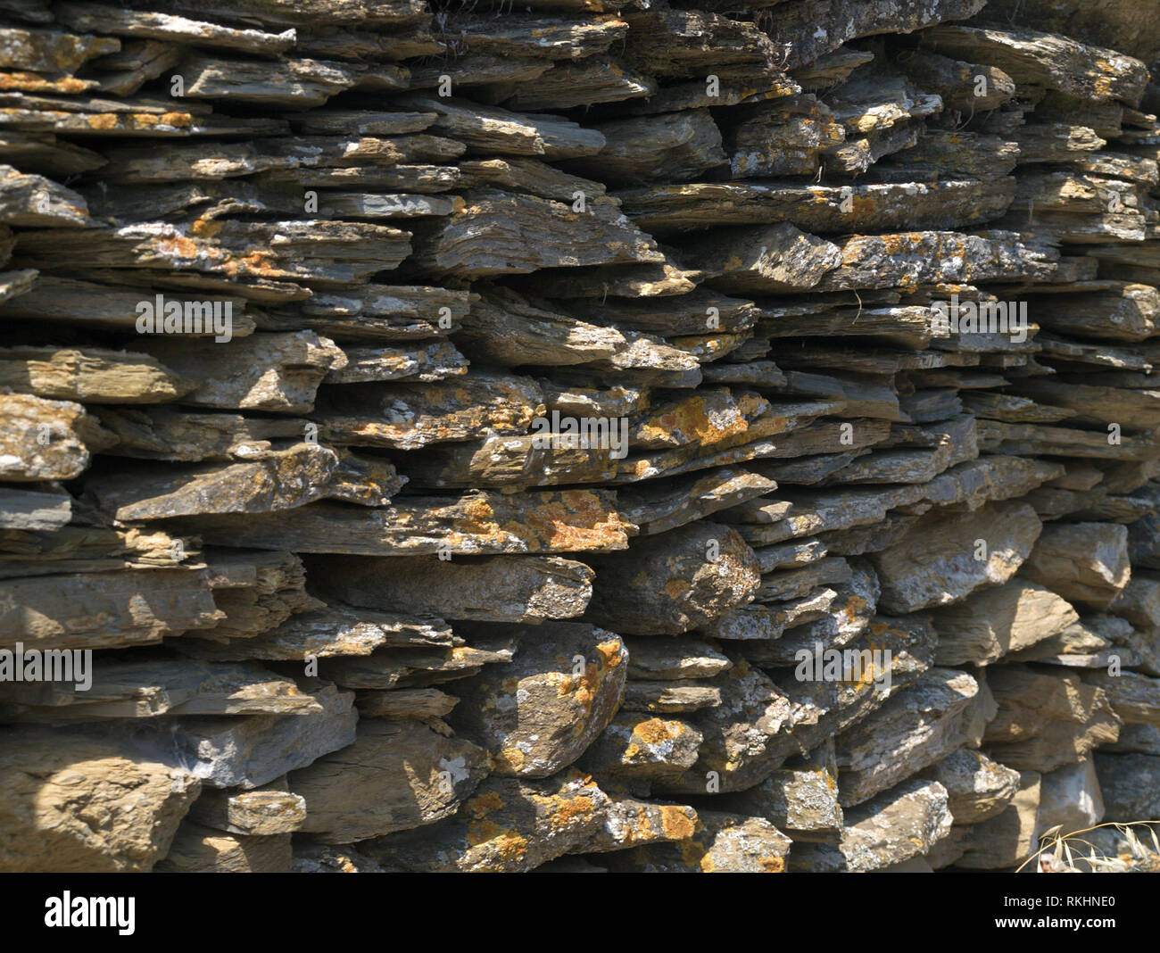 Stacked stone wall in day light Stock Photo - Alamy
