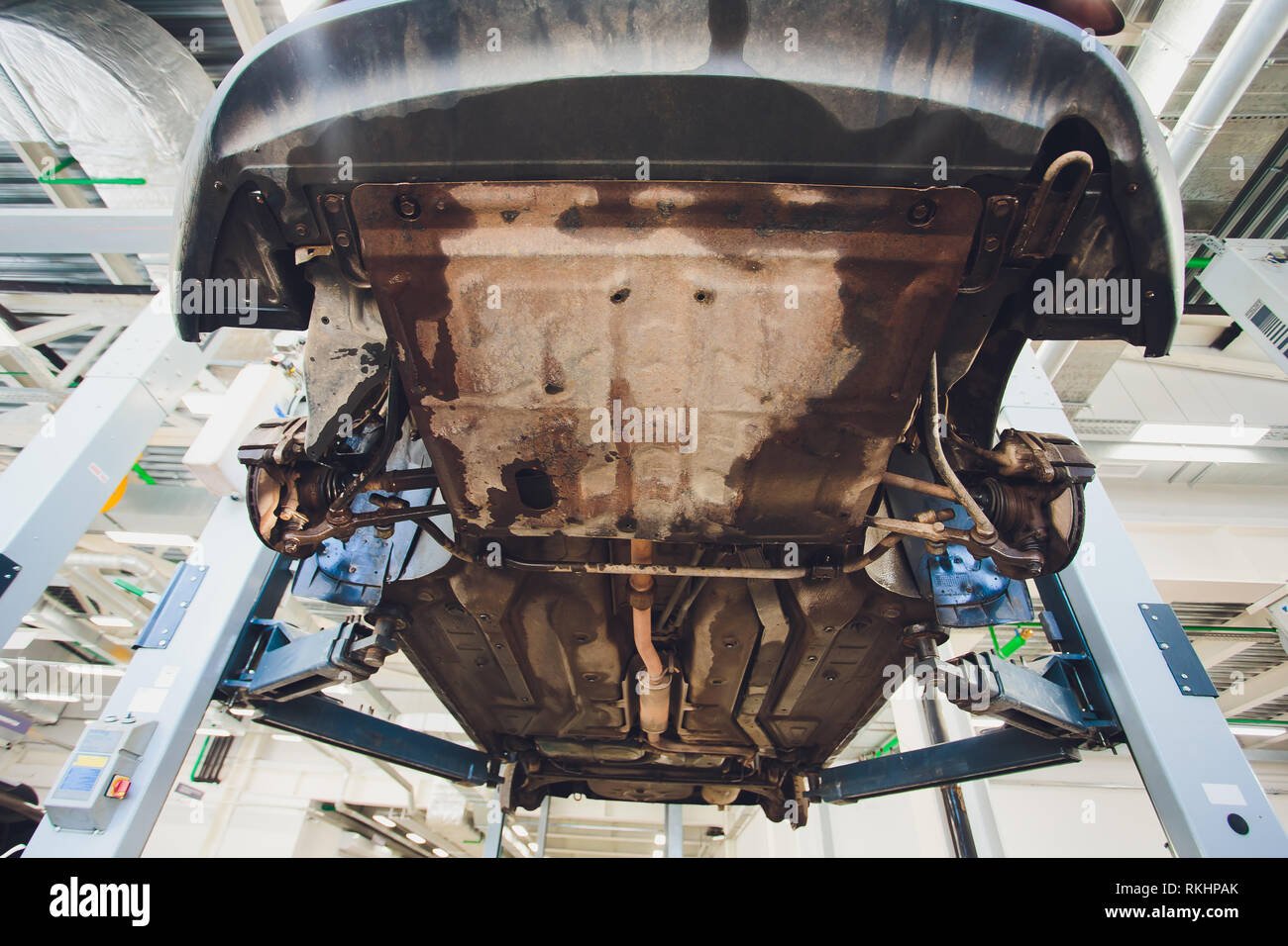 Car raised on car lift in autoservice Stock Photo - Alamy