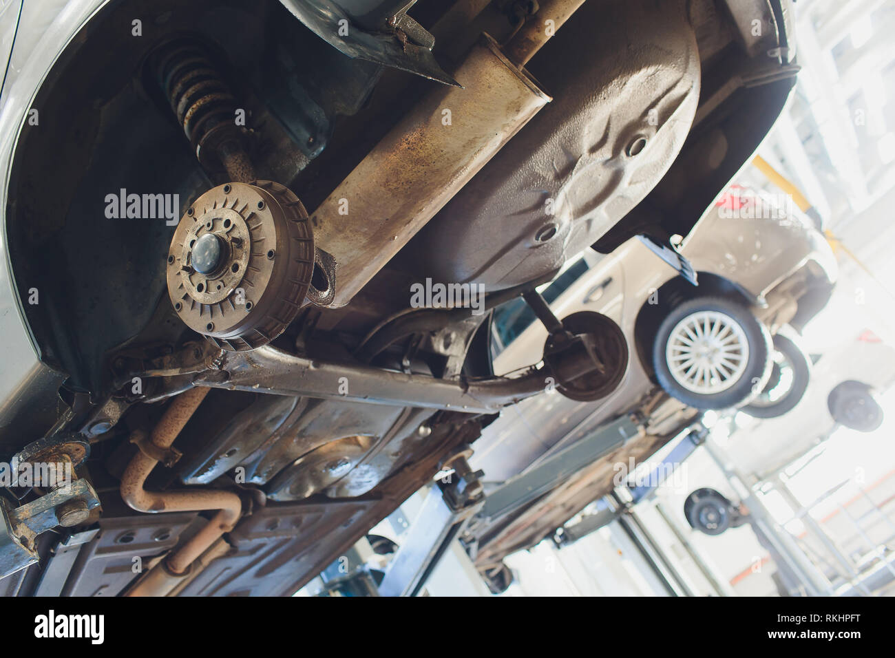 Car raised on car lift in autoservice Stock Photo - Alamy