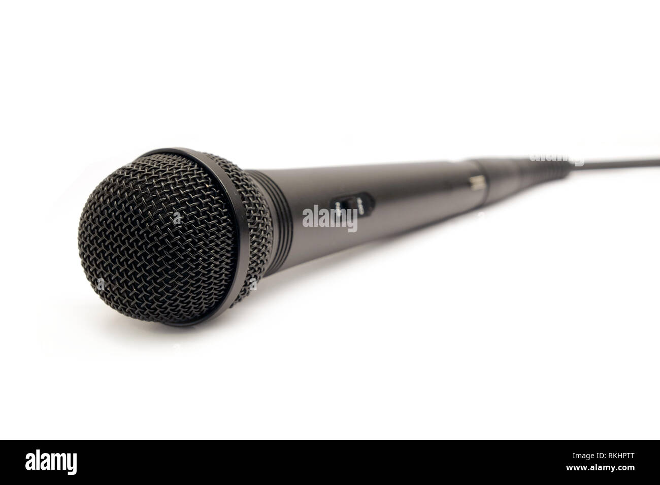 Long black studio vocal microphone with on button on body and wire ...