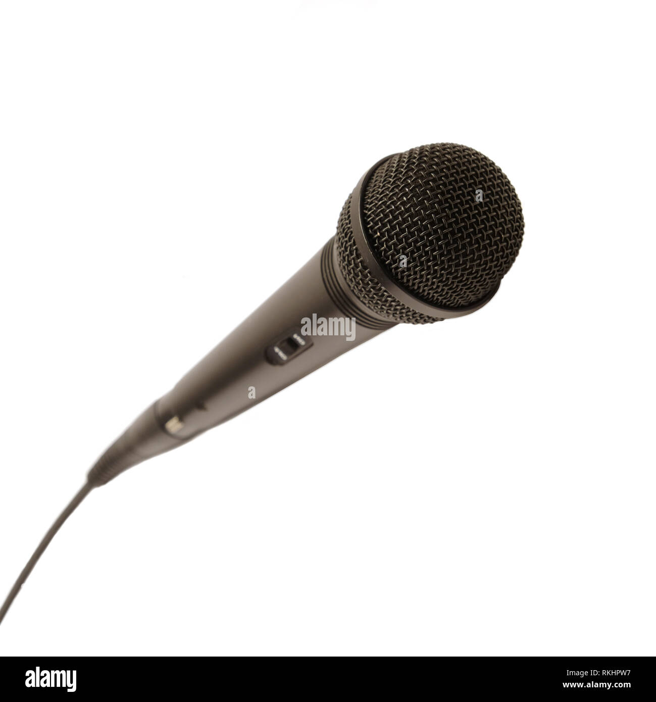 Long black studio vocal microphone with on button on body and wire ...
