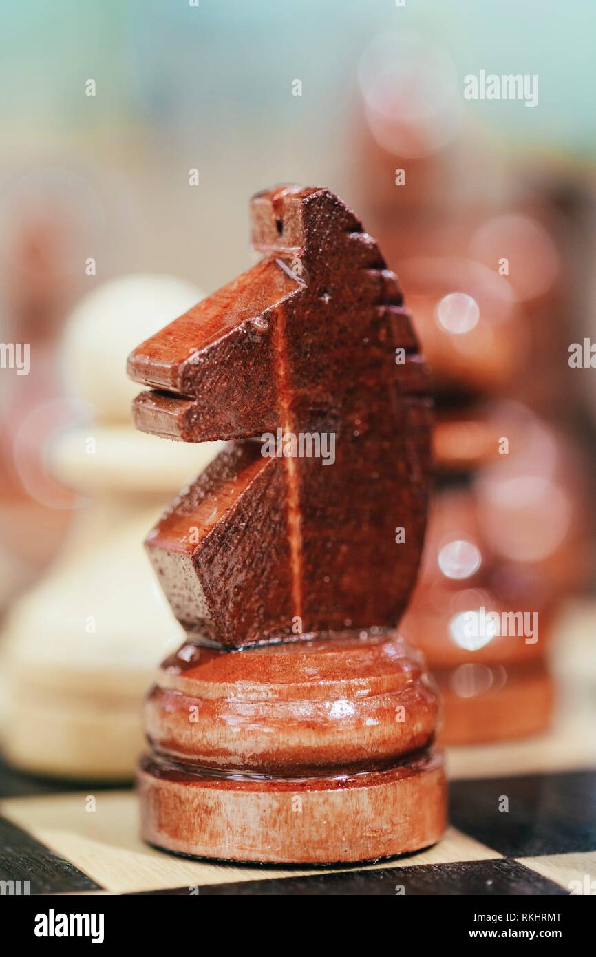 Old Brown Chess Knight Standing On Wooden Chessboard Stock Photo - Alamy