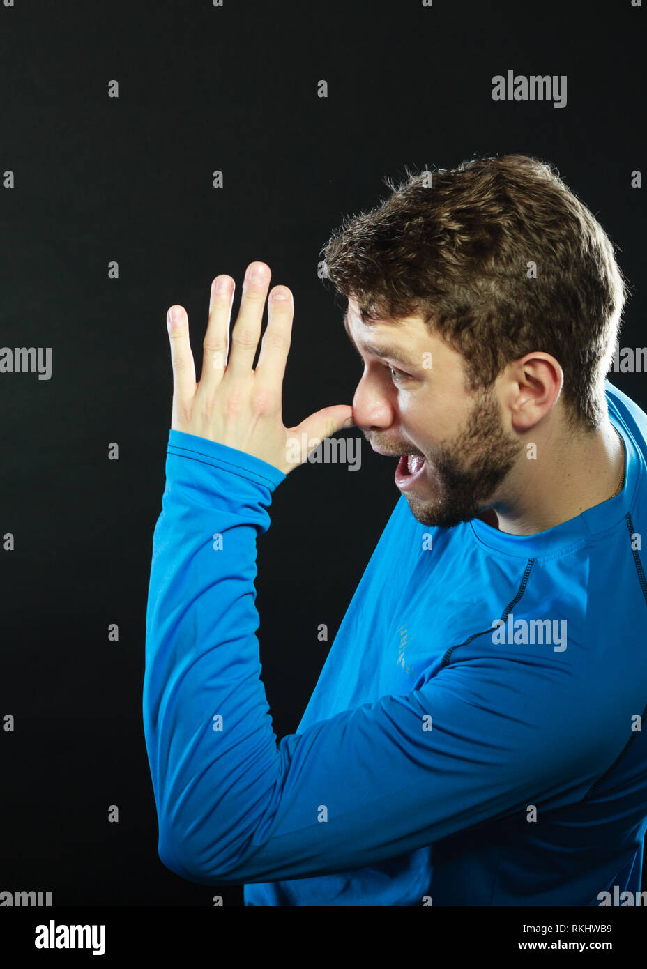 Happy joyful man guy mocking having fun playing the fool in studio on ...