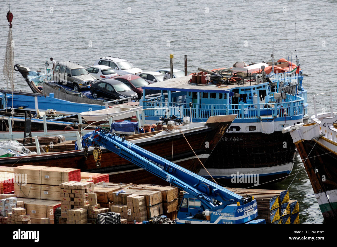 An Ocean going wooden Dhow ( Arab Boat) being loaded with cargo on the ...