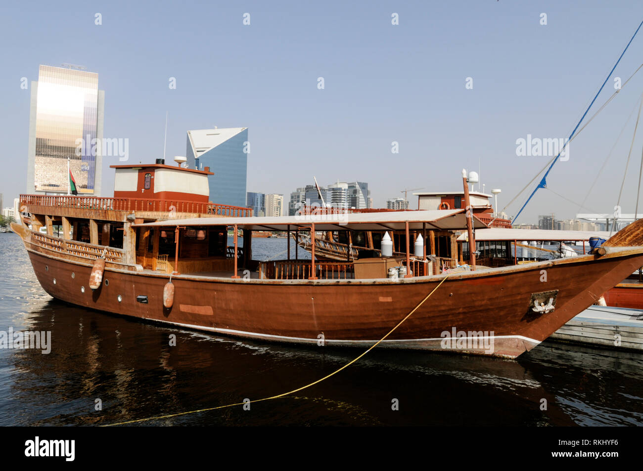 Two converted dhows ( Arab boat) used for taking tourists on a sign ...