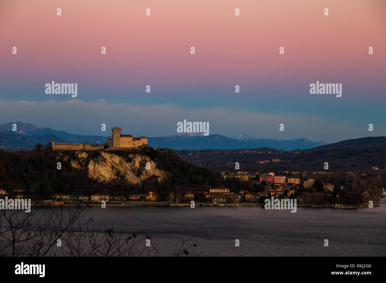 View of the fortress of Angera at sunset from a height above Arona ...
