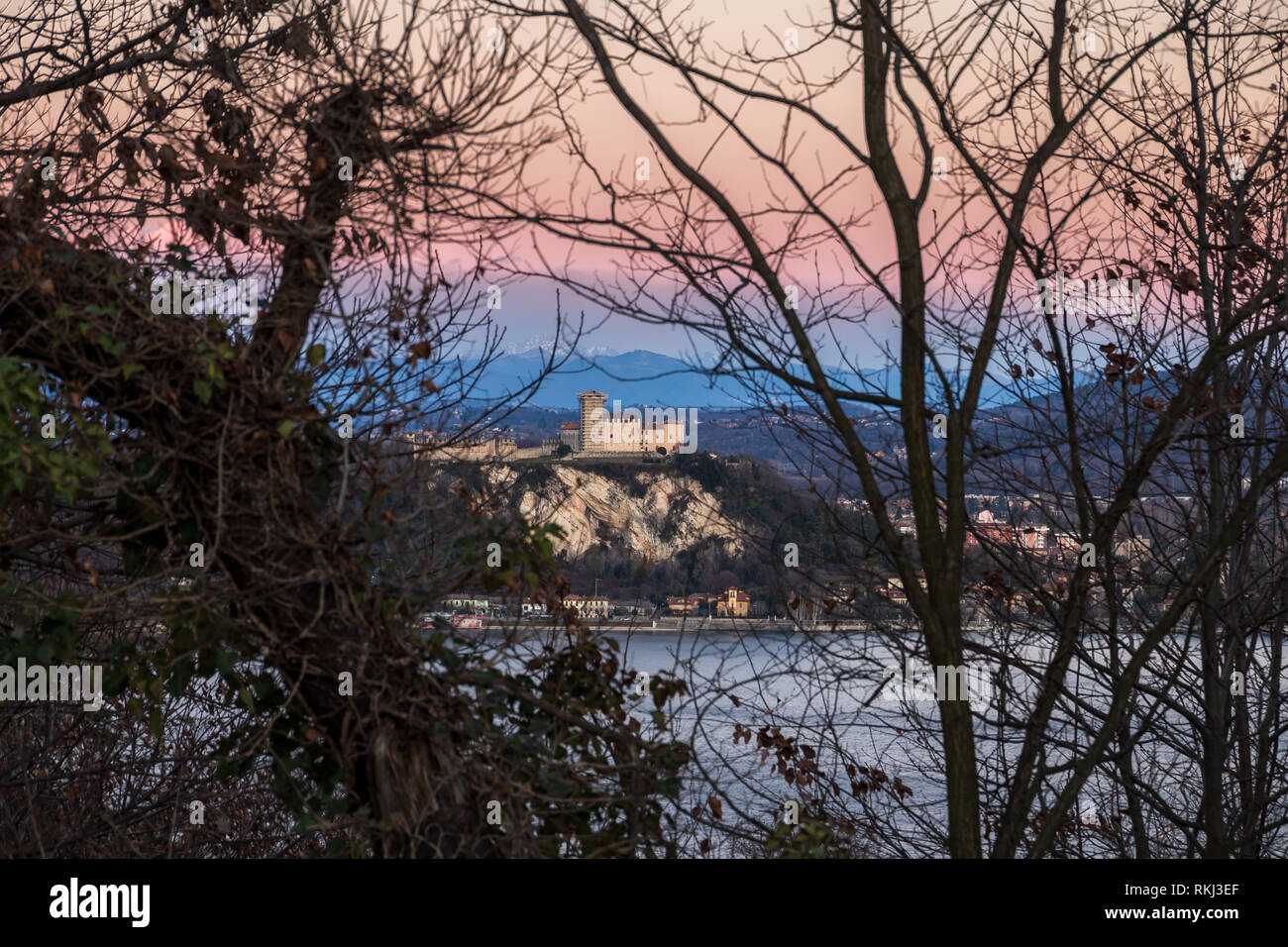 View of the fortress of Angera at sunset from a height above Arona ...