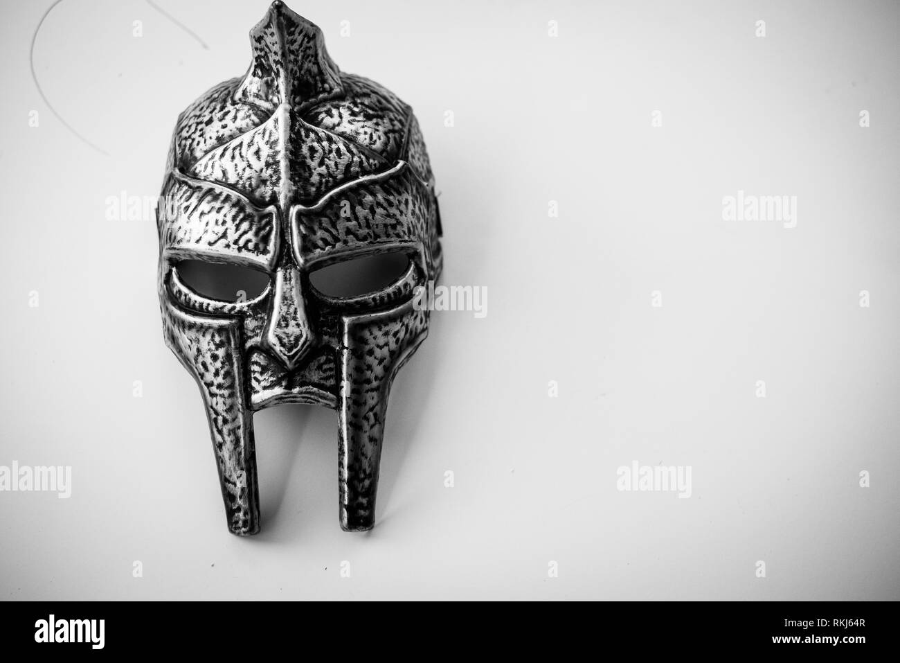 A toy Roman helmet sits on a white background Stock Photo - Alamy