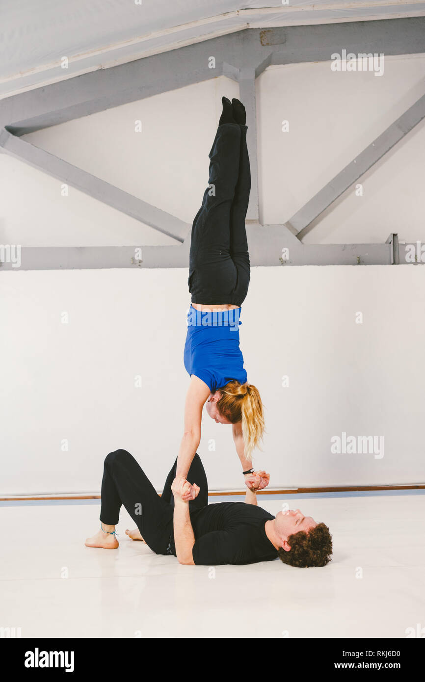 Strong acrobatic woman lifting man hi-res stock photography and images ...