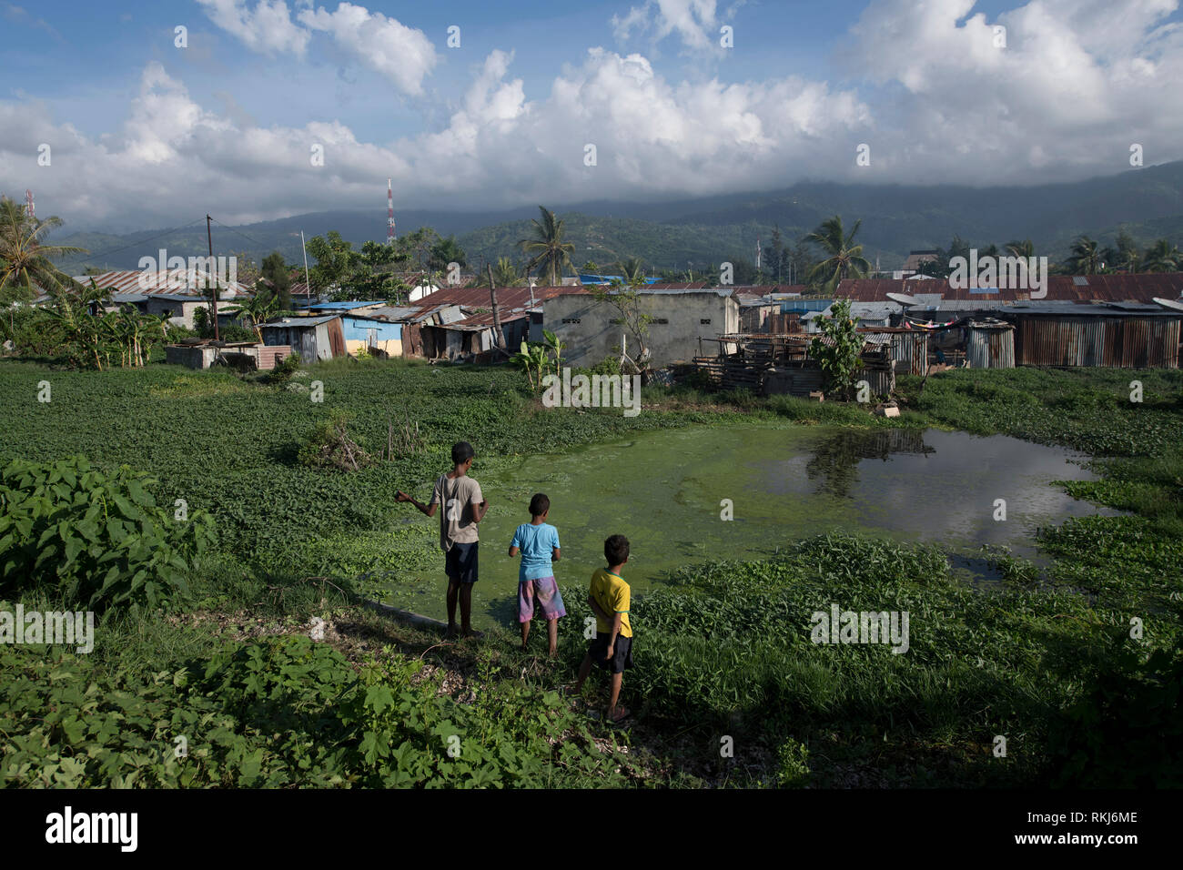 Township, Kids at pond near shacks, Dili, East Timor Stock Photo - Alamy