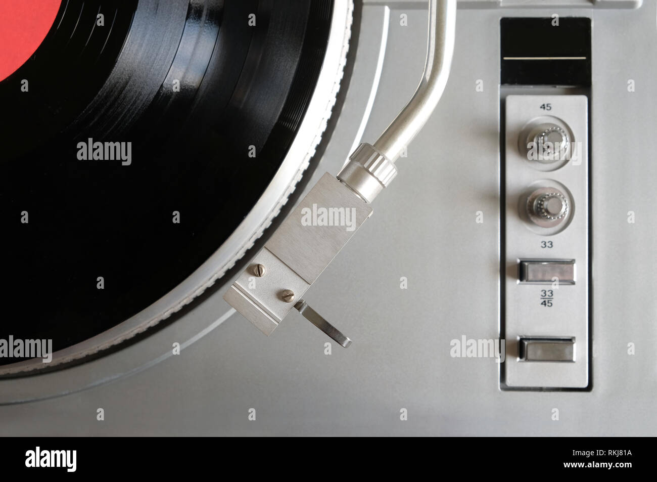 Vintage turntable in silver case with buttons and knobs on control ...