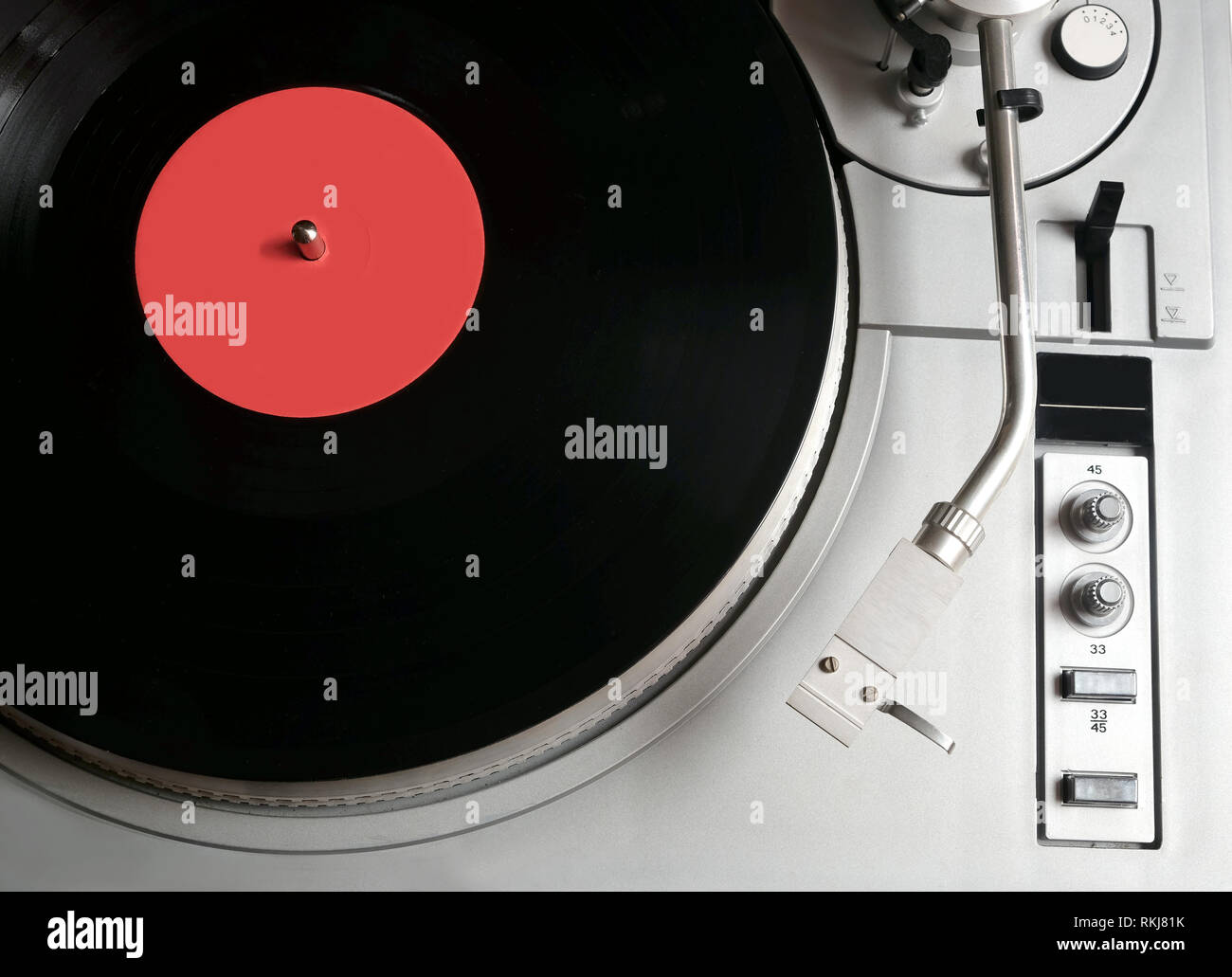 Vintage turntable in silver case with buttons and knobs on control ...