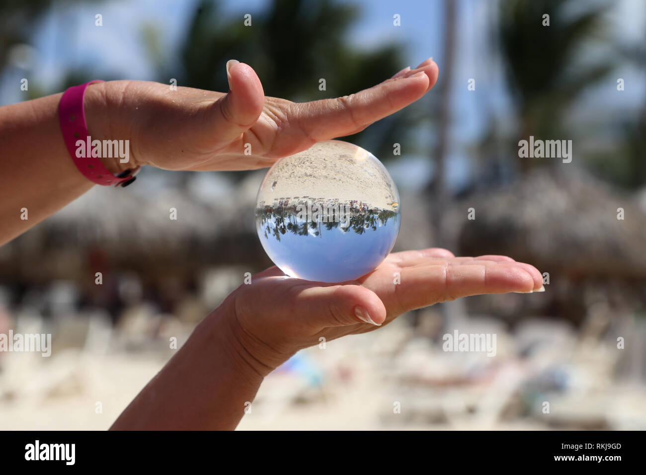 Glass ball. Beach through a glass ball Stock Photo - Alamy