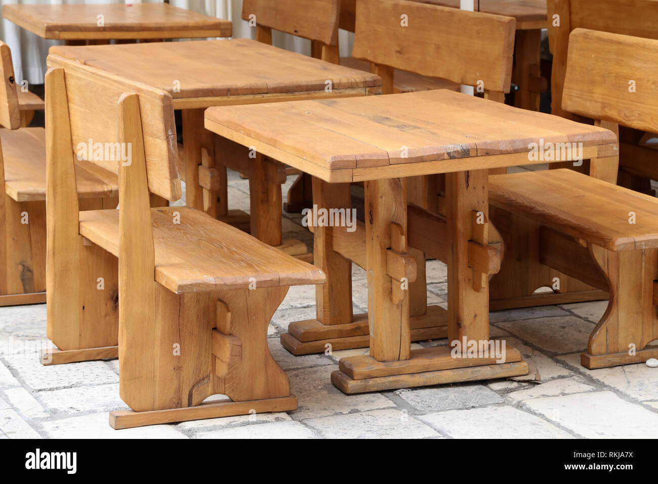 Cozy street restaurant. Tables and chairs in the street Stock Photo - Alamy