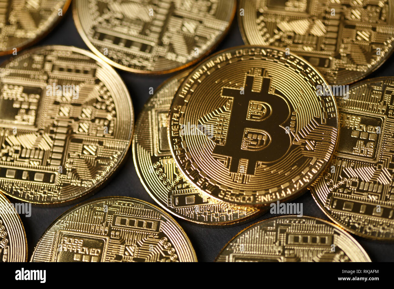 Bitcoins and New Virtual money concept.Stack of Many gold bitcoins on ... Bitcoins and New Virtual money concept.Stack of Many gold bitcoins on ...
