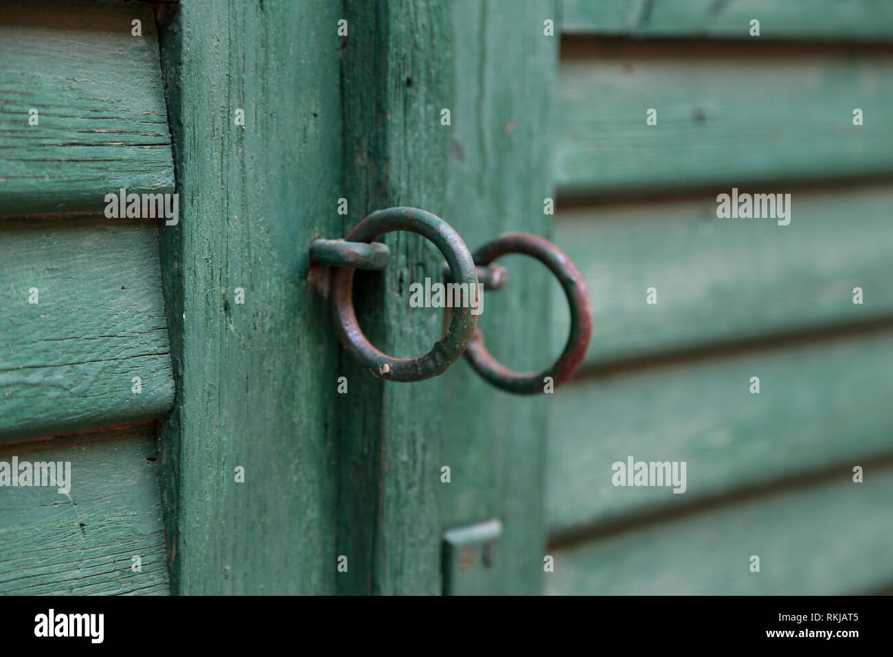 Metal rings on the gate / wooden door gate with a forged handle ring ...