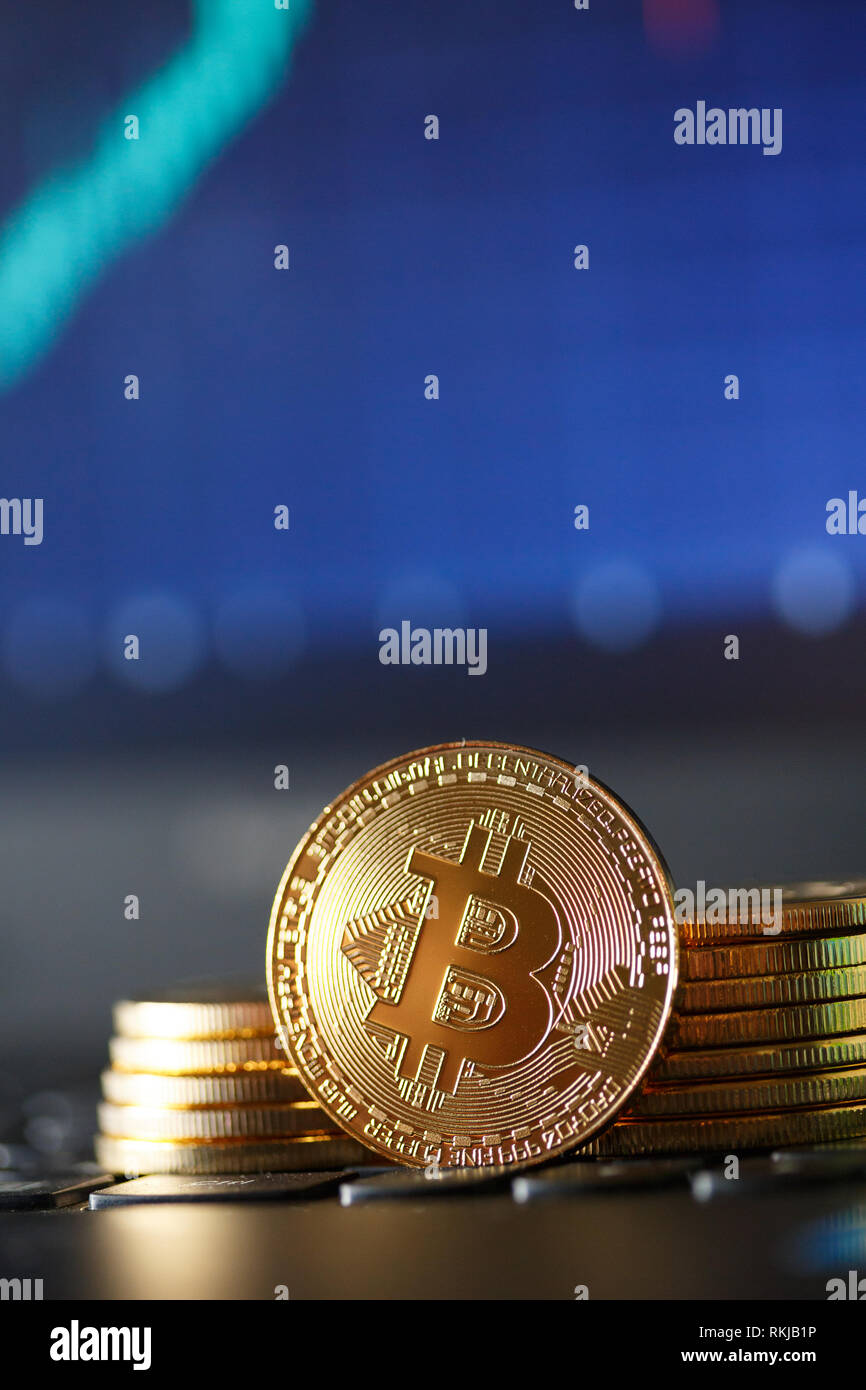 Bitcoin gold coin and chart background. Virtual cryptocurrency concept ...
