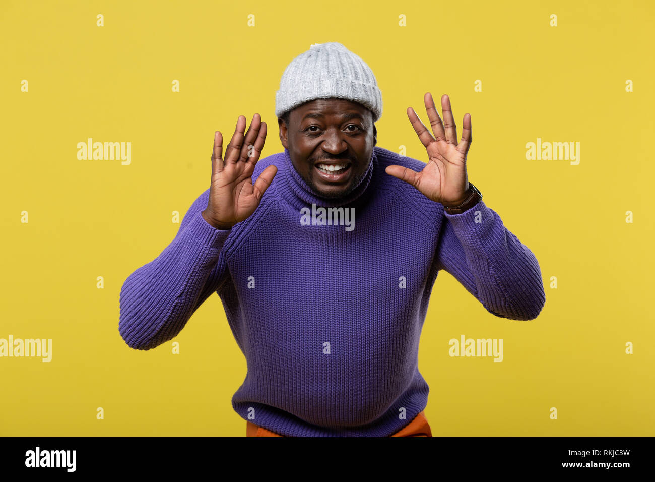 Happy model raising his both hands up Stock Photo - Alamy
