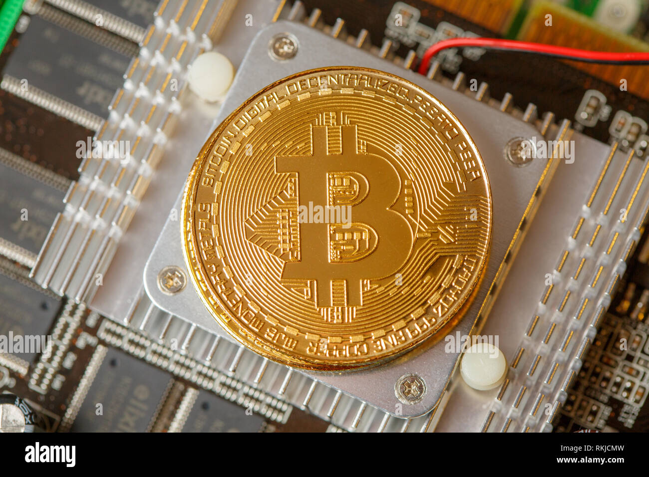 Bitcoin. Gold Bitcoin electronic computer processor board Stock Photo - Alamy