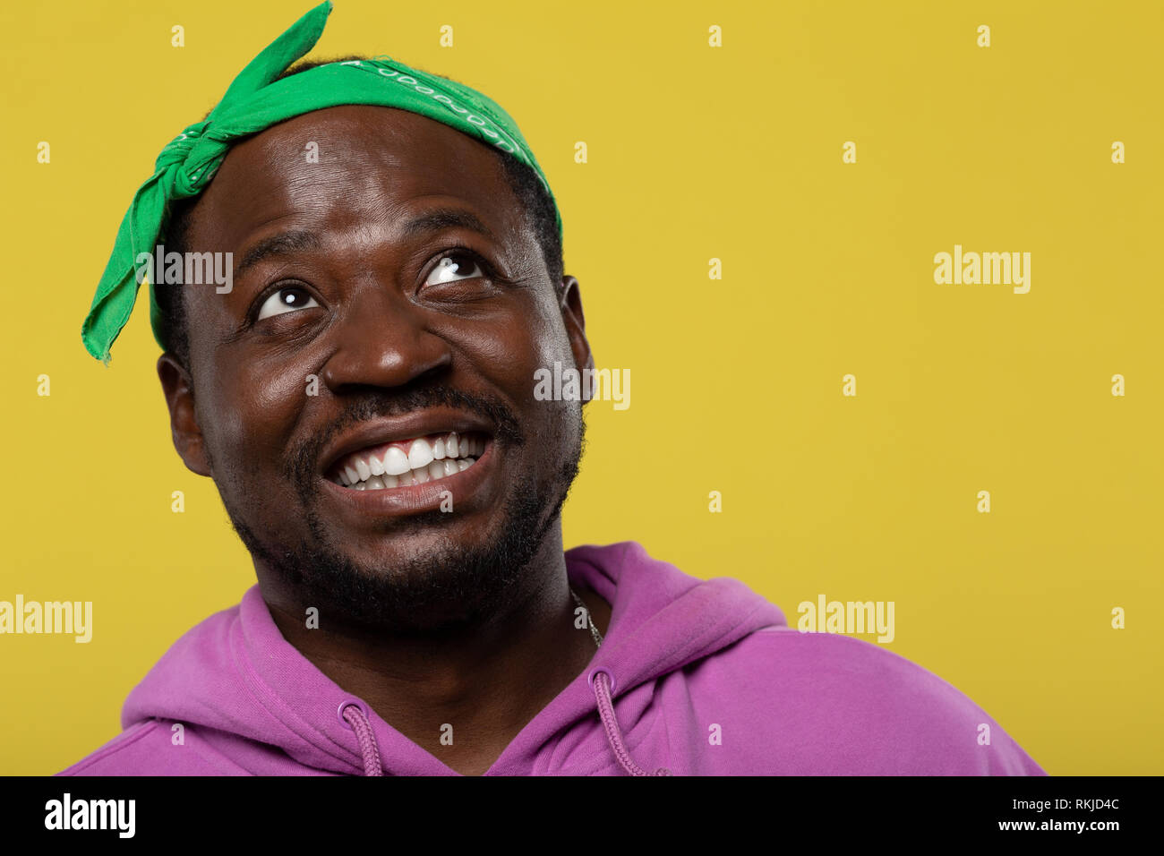 Positive delighted man keeping smile on his face Stock Photo - Alamy