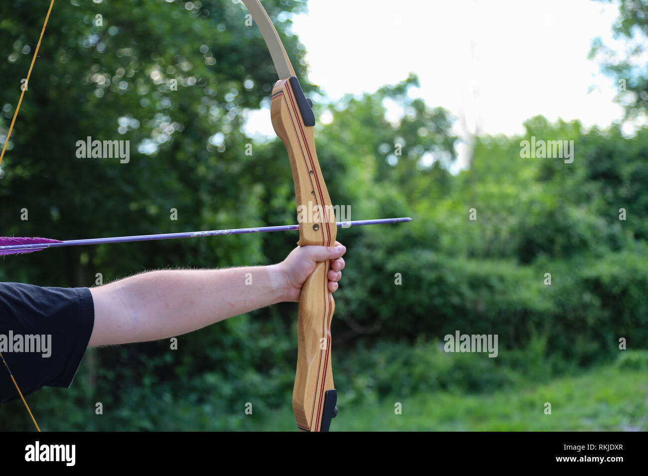 Archery / Shooter prepares for the shot and aims to shoot the bow in ...
