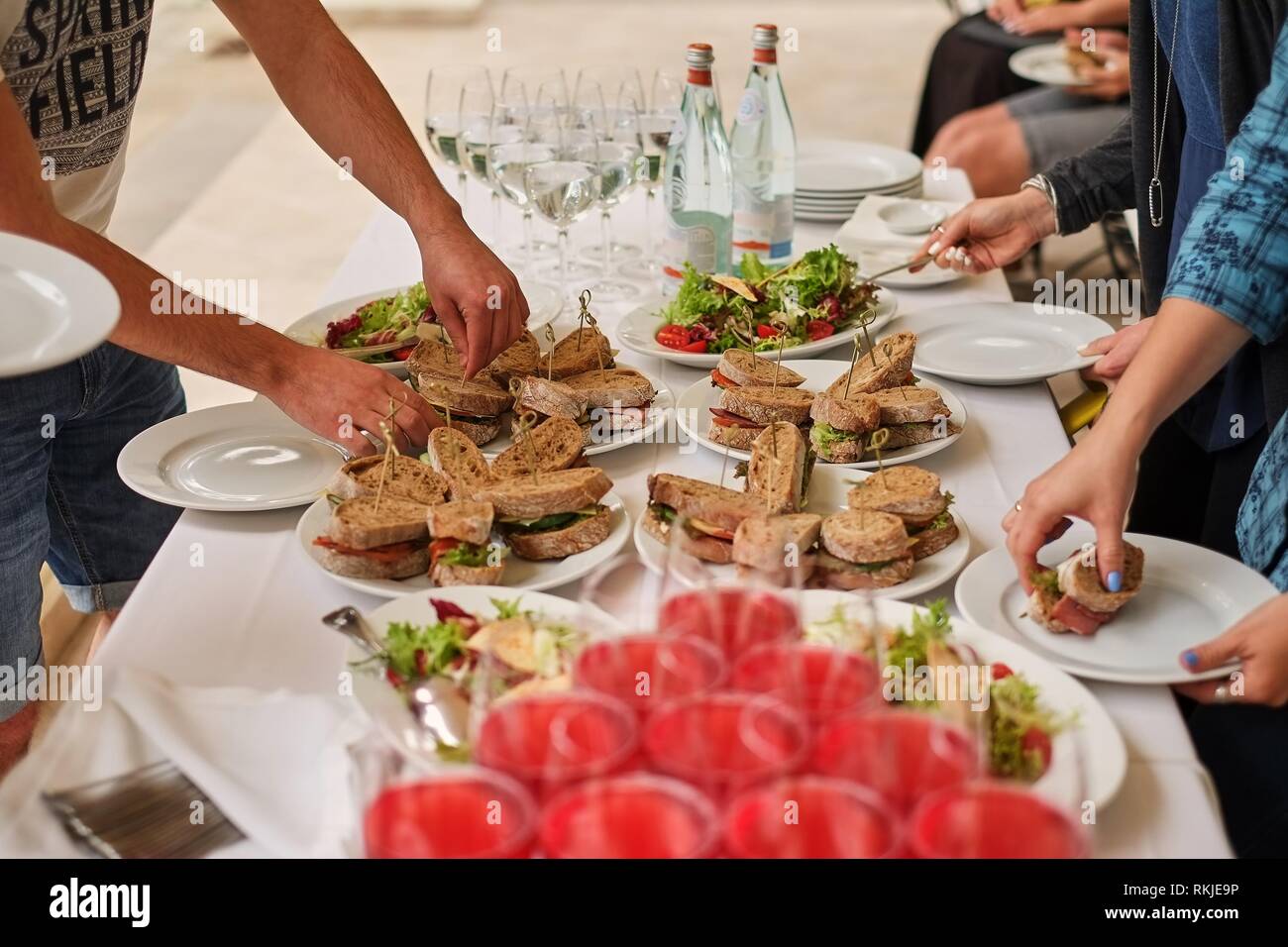 Snacks, fish and meat specialities on the buffet. white table Stock ...