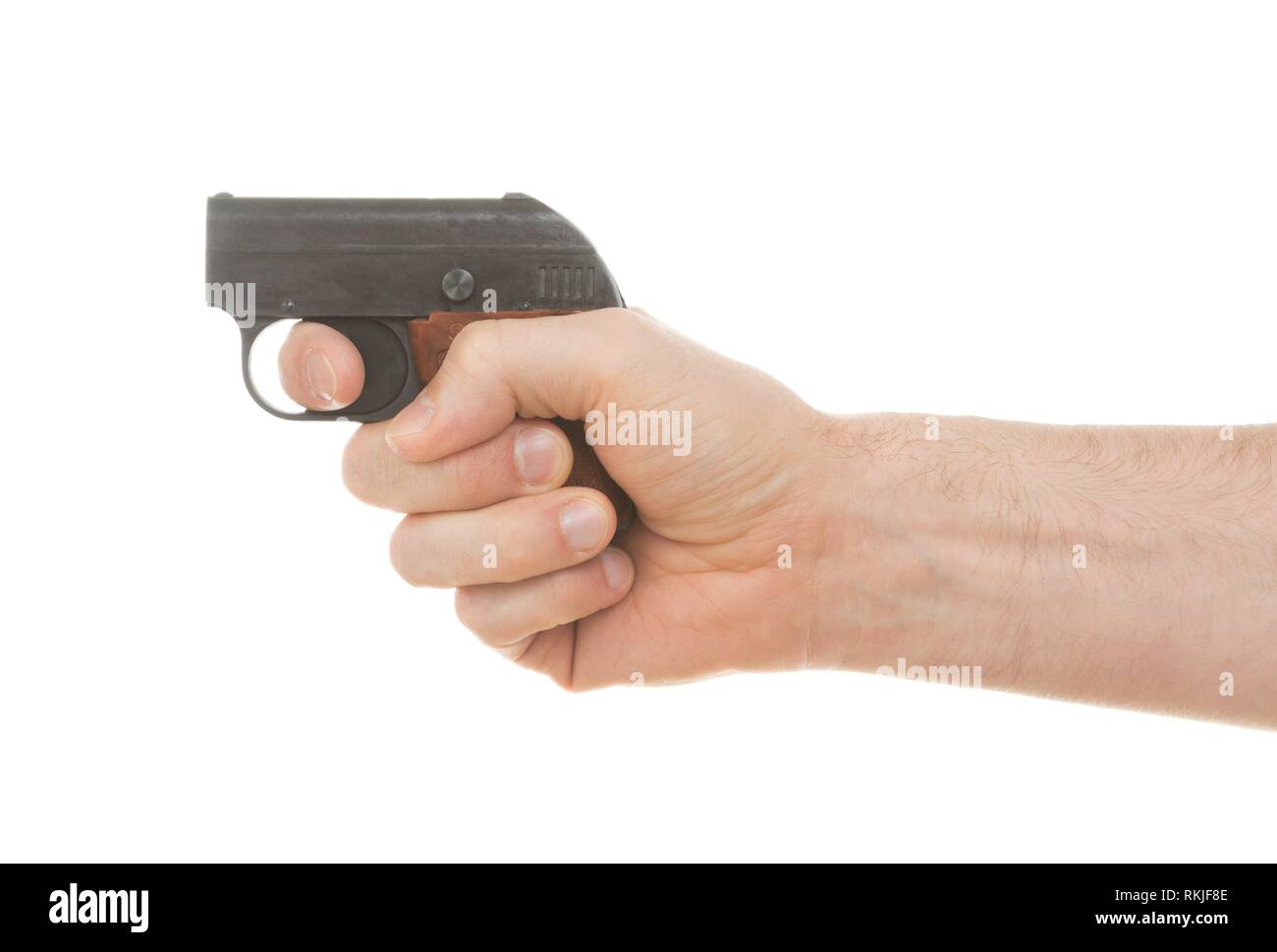 Small old alarm pistol in the hands of an adult man Stock Photo - Alamy
