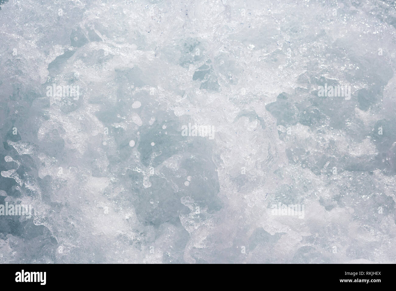 Churned up seawater, overhead and close-up Stock Photo - Alamy