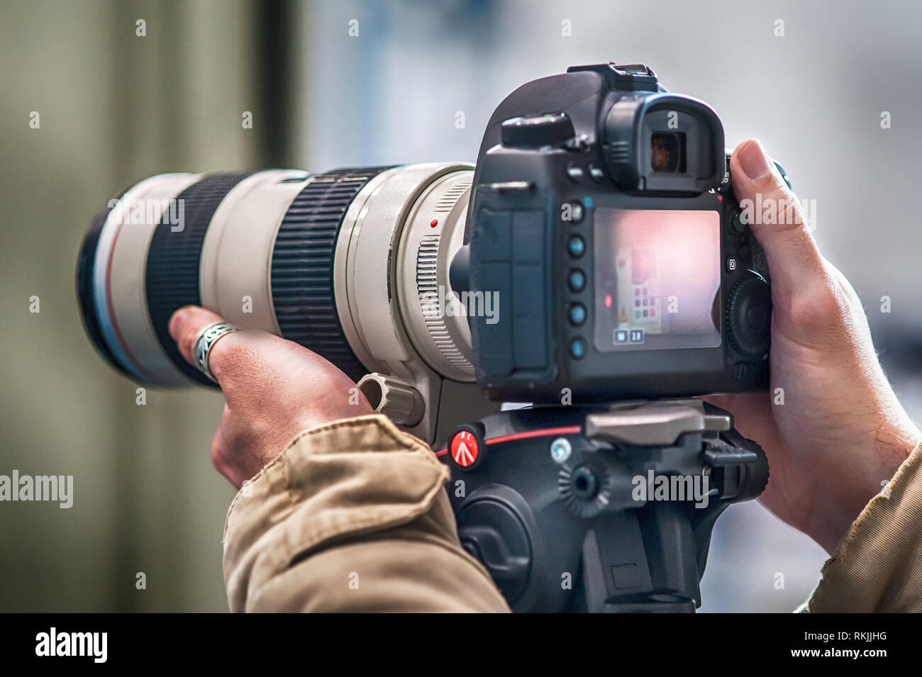 Man hand holding camera and take the photo. Selective focus Stock Photo ...