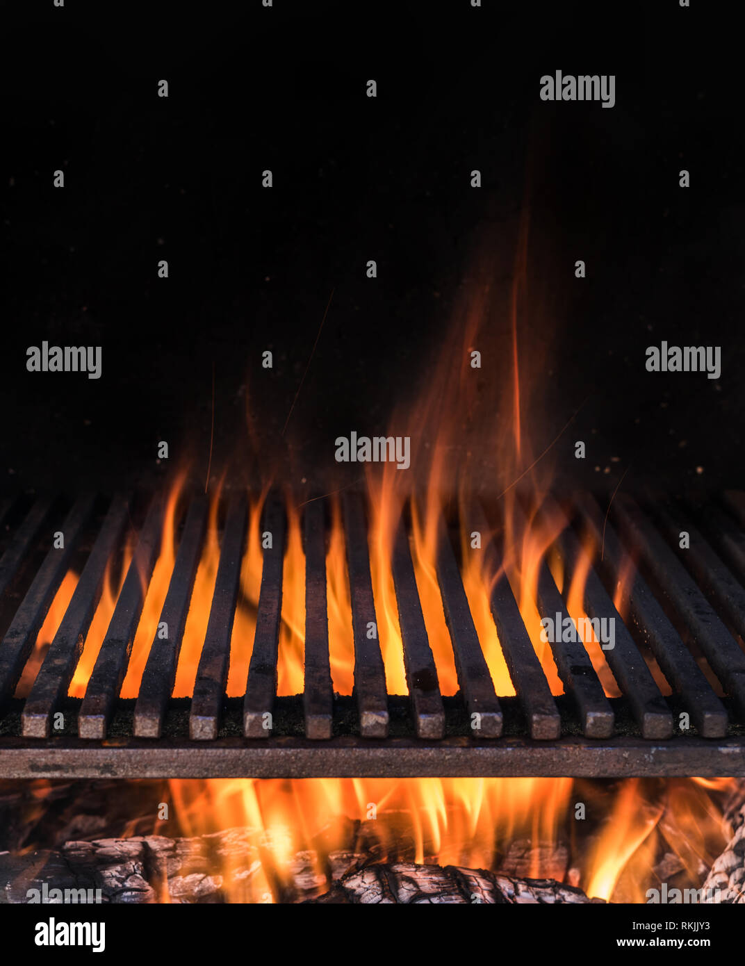 Empty grill grate and tongues of fire flame. Barbeque night background ...