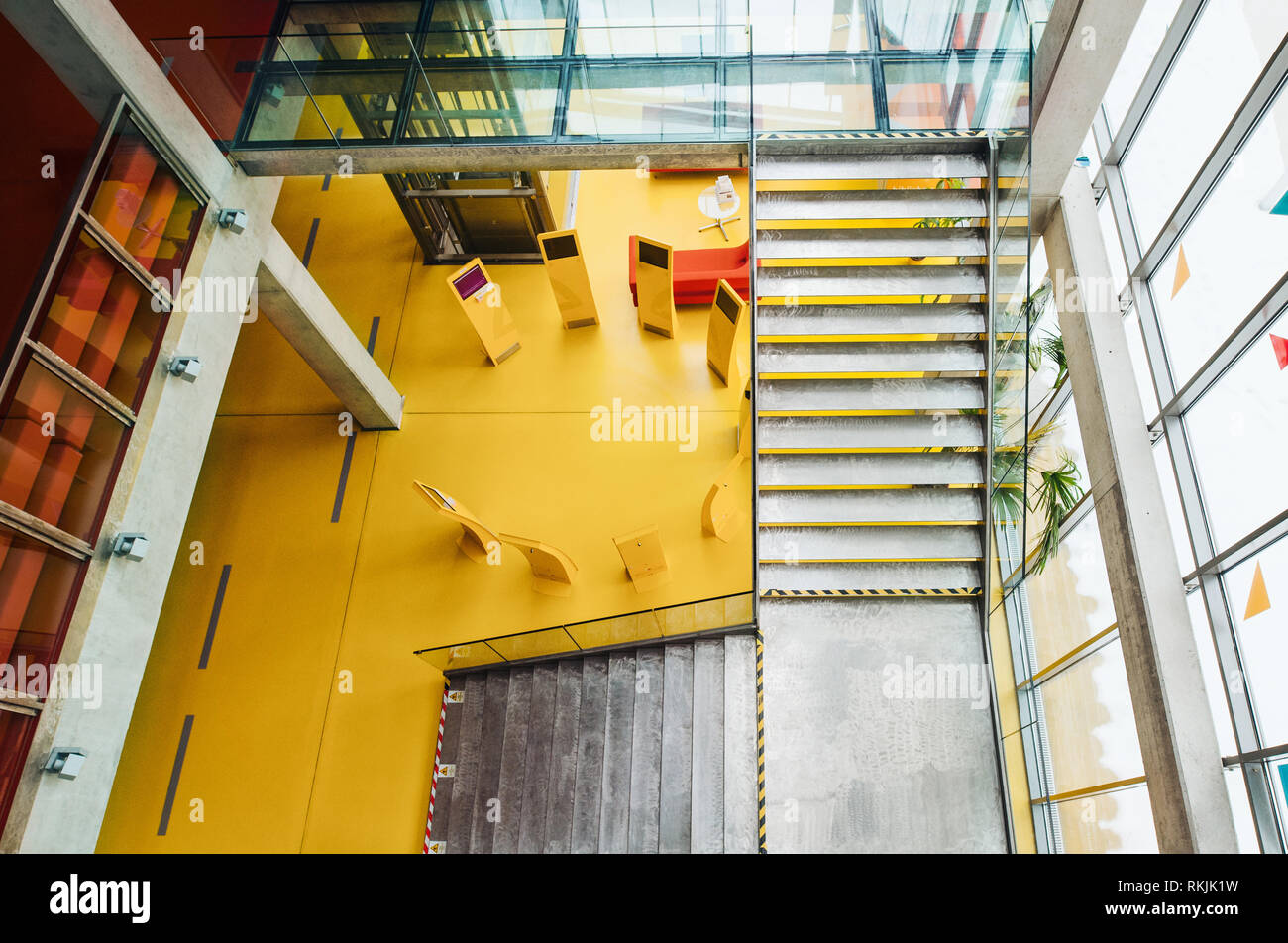 High-angle view of interior of a modern spacious library with computers ...